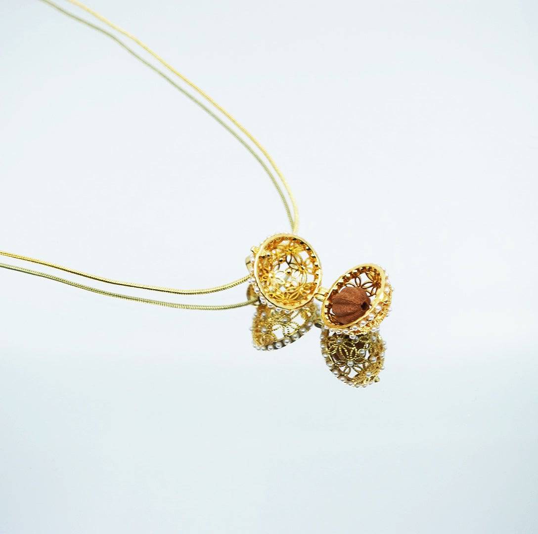 Gold filigree locket store